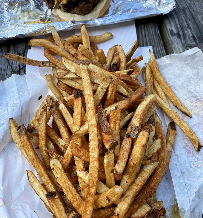 Fresh-cut fries with personality—some crispy, some tender, all delicious. These aren't uniform factory fries; they're potato personalities.