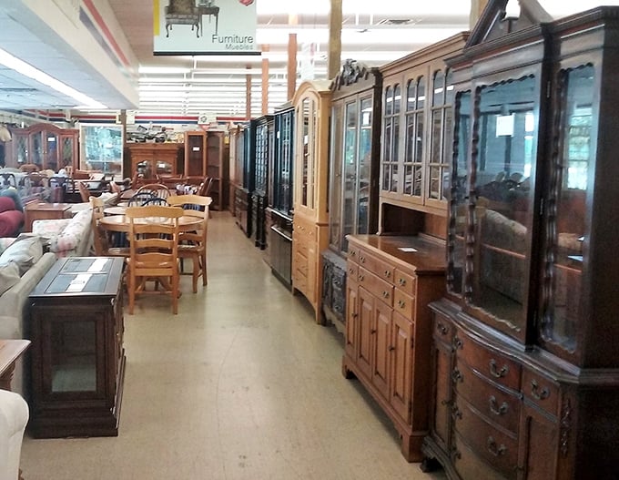 Solid wood furniture with stories to tell lines this aisle of possibility. These aren't just cabinets and hutches—they're future family heirlooms waiting for their next chapter.