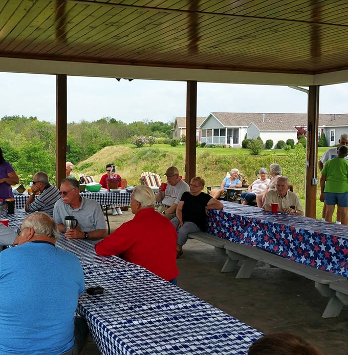 Community in action—where strangers become neighbors and neighbors become friends. Nothing builds bonds quite like shared meals under an open pavilion.