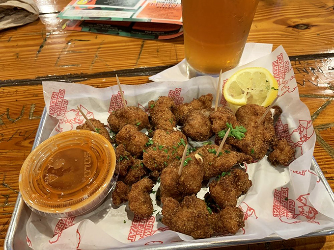 These golden-fried gator tail bites aren't just Florida on a plate—they're a crunchy initiation ritual. The dipping sauce is practically mandatory.