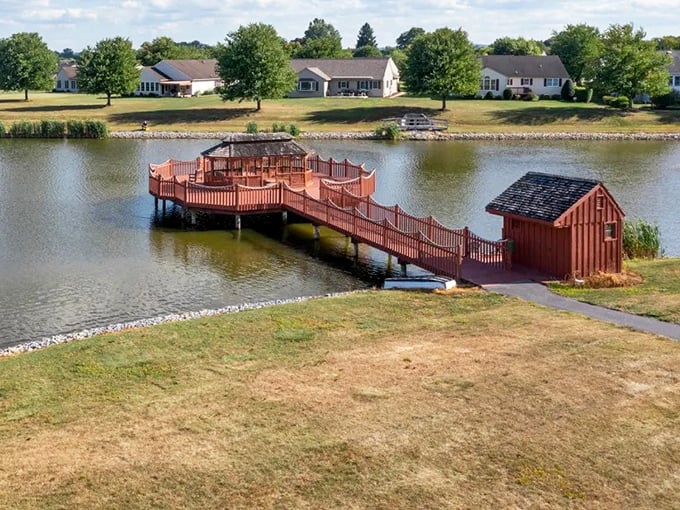 This lakeside gazebo isn't just Instagram-worthy – it's life-worthy. A wooden sanctuary extending over water that practically begs for sunset gatherings.