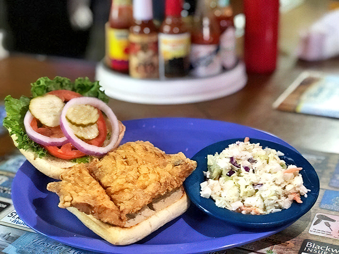 A proper fish sandwich isn't about fancy presentation – it's about fresh catch, proper seasoning, and the kind of coleslaw that makes you reconsider your relationship with cabbage.