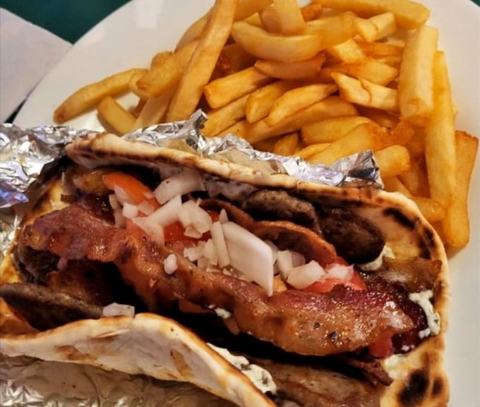 The legendary gyro – where seasoned meat, fresh veggies, and tzatziki come together in a handheld miracle that makes you forget fancy dining exists.