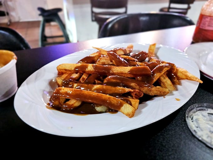Chips smothered in gravy—a comfort food rebellion against Nevada's desert heat. This plate doesn't need neon lights to announce its delicious presence.