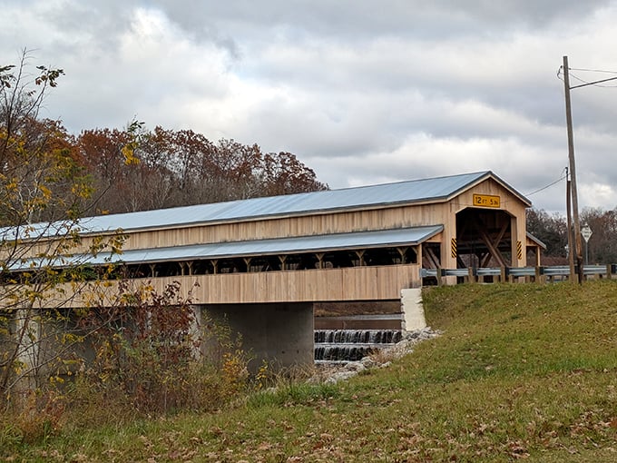 The Historic Harpersfield Covered Bridge – where modern traffic meets 19th-century engineering in a relationship that somehow works better than most dating apps.