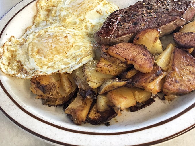 These home fries aren't just potatoes—they're little golden nuggets of breakfast perfection, seasoned and crisped on a well-seasoned griddle.