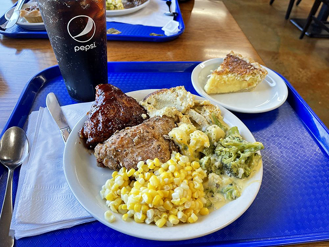 A plate that tells Indiana's story better than any history book: hearty meat, sunshine-yellow corn, and a slice of sugar cream pie waiting patiently.