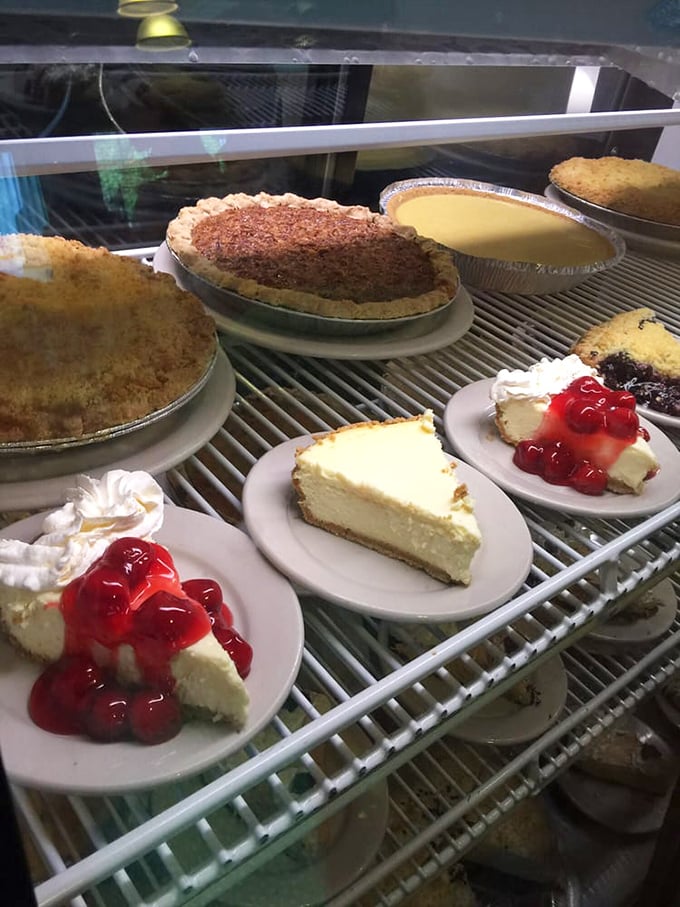 The dessert case – where diets go to die and memories are born. Those cherry-topped cheesecake slices are calling your name.