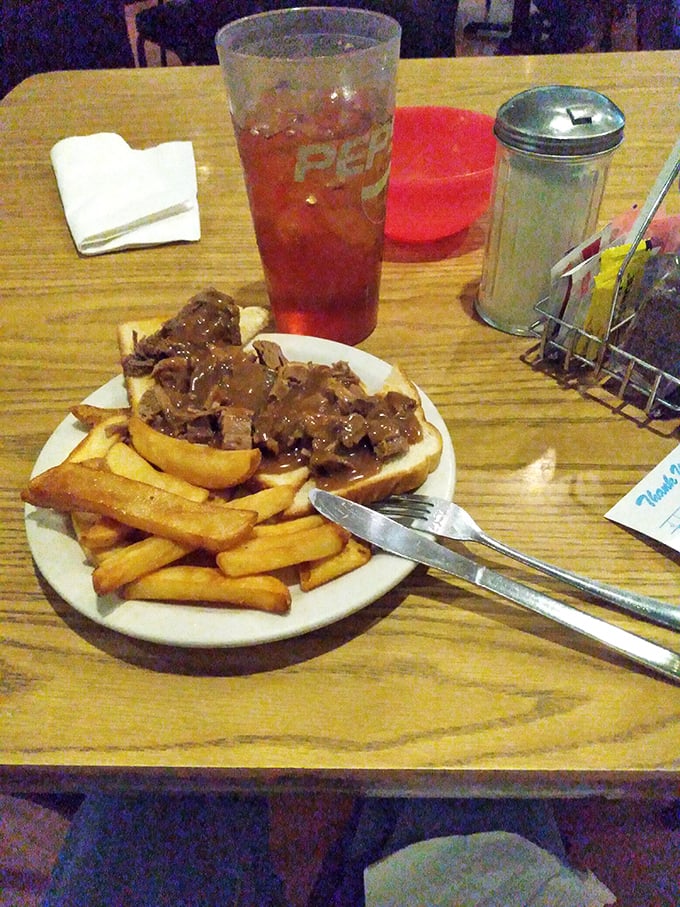 The hot roast beef sandwich – where gravy isn't just an addition, it's practically a spiritual experience flooding across Texas toast.