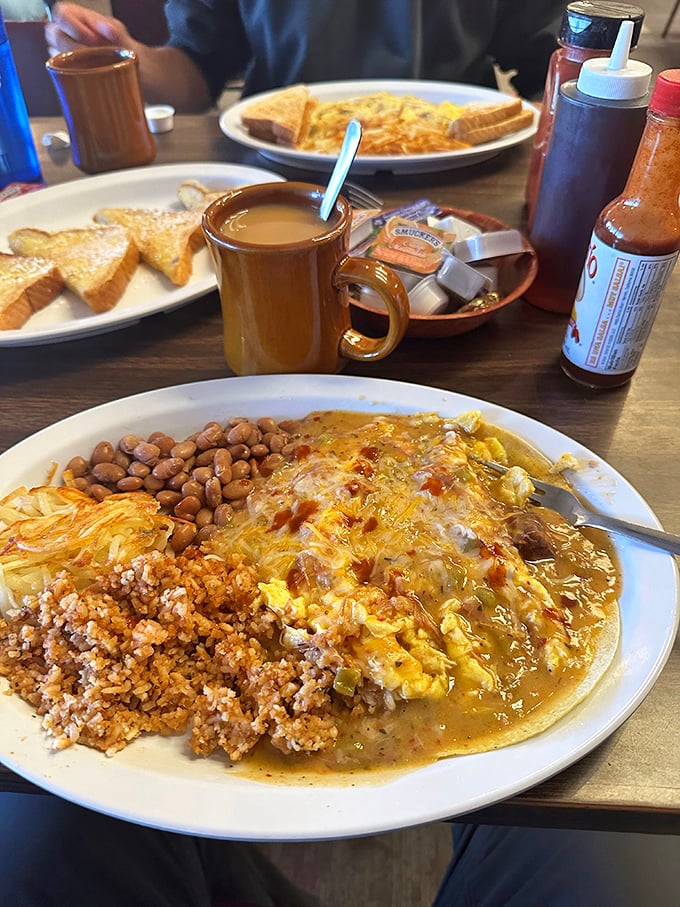 This isn't just breakfast—it's a Southwest symphony on a plate. Rice, beans, eggs, and that green chile sauce that makes everything better.