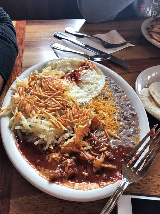This isn't just Mexican breakfast—it's a fiesta of flavors with melted cheese, savory beans, and crispy hashbrowns playing supporting roles.