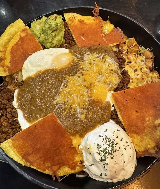 Huevos Rancheros reimagined as a Detroit symphony—corn tortillas, salsa verde, and perfectly cooked eggs create breakfast music for your mouth.