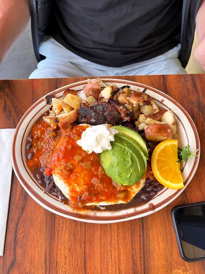 Huevos Rancheros that would make your abuela proud—a fiesta of colors with that perfectly ripe avocado stealing the spotlight.