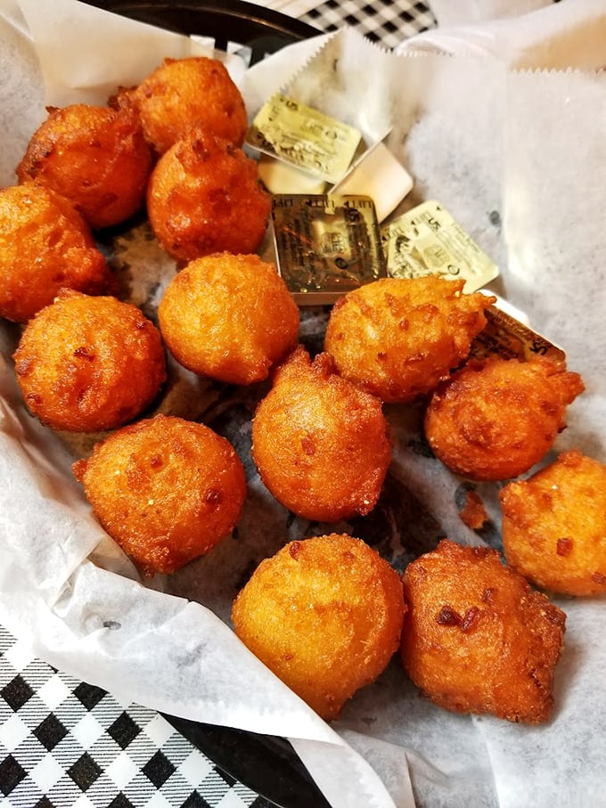 These aren't just hush puppies—they're little orbs of cornmeal joy that could make a vegetarian question their life choices.