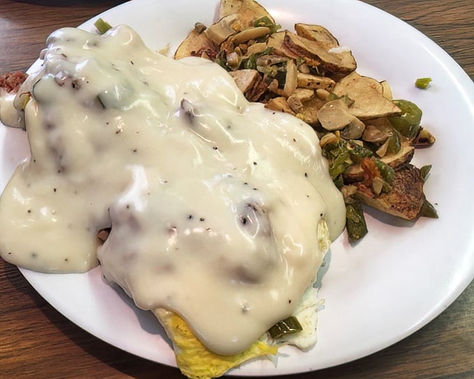This Irish breakfast isn't playing around—eggs smothered in gravy alongside home fries that look like they've been practicing their crispy edges for decades.