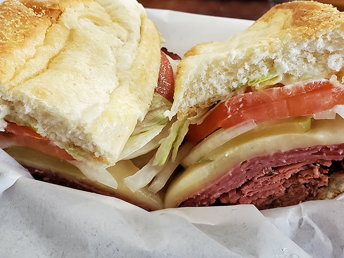This isn't just a sandwich; it's architectural genius. Layers of meat, cheese, and veggies stacked with the precision of a delicious Jenga tower.