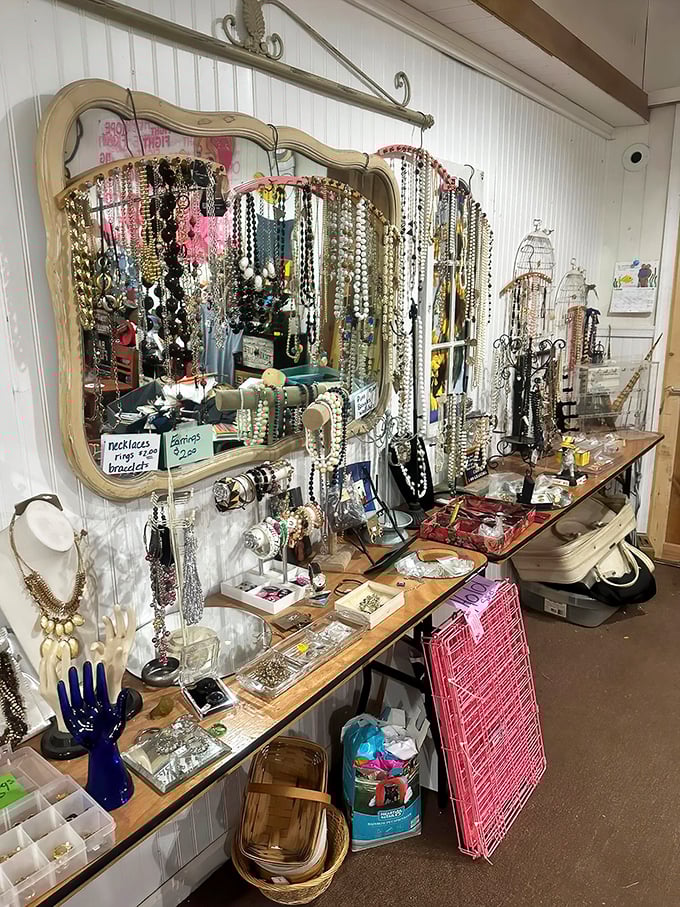 Vintage mirror magic transforms jewelry shopping into an event. Necklaces cascade like waterfalls of history, each with stories to tell.
