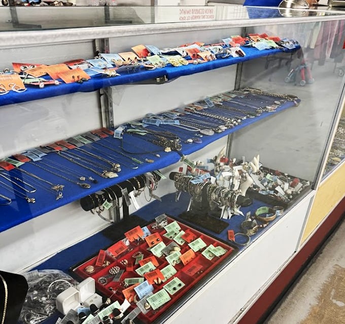 Behind glass lies a glittering universe of accessories—proof that someone's discarded jewelry box is another's treasure chest of possibilities.