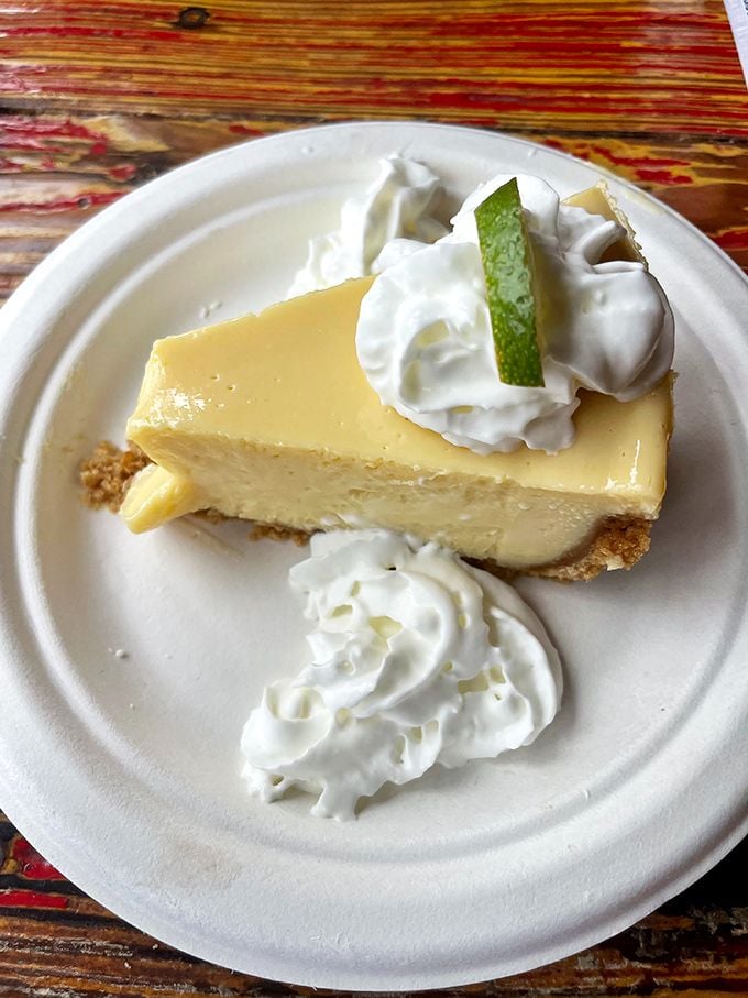 Key lime pie that strikes the perfect balance between tart and sweet. That dollop of whipped cream isn't just garnish—it's essential equilibrium.