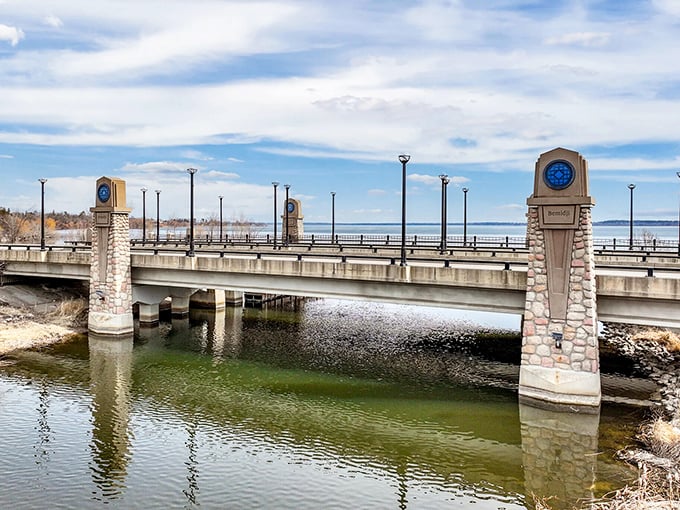This bridge doesn't just connect two shores—it frames Lake Bemidji's vastness with architectural details that whisper "this place matters."