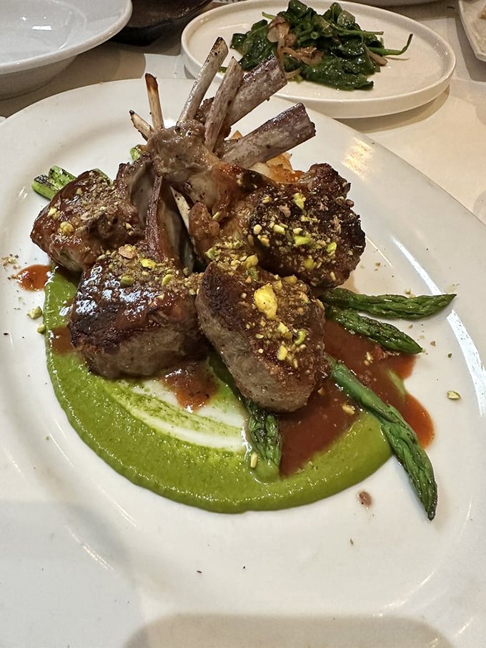 Rack of lamb that stands at attention like it's auditioning for a Michelin star. That mint pesto base isn't just green—it's money.