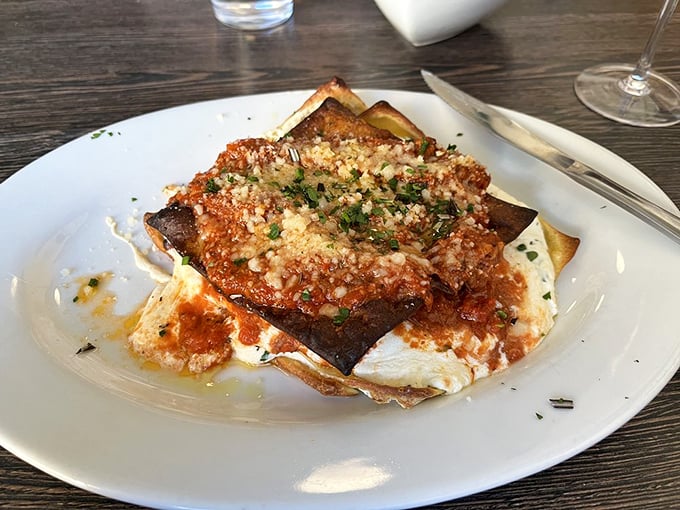 Layers of pasta, sauce, and cheese in perfect harmony. This lasagna doesn't just satisfy hunger – it resolves existential crises one bite at a time.