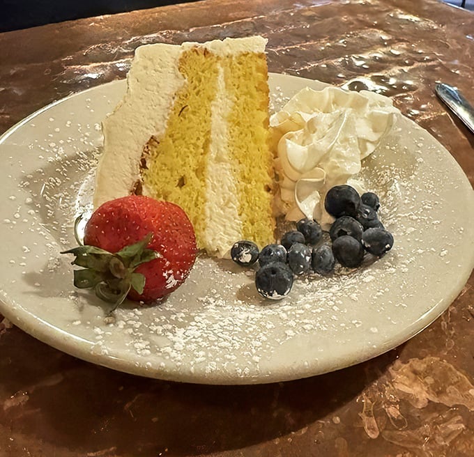 This lemon cake stands tall and proud, dressed in cream like Marilyn Monroe in white.