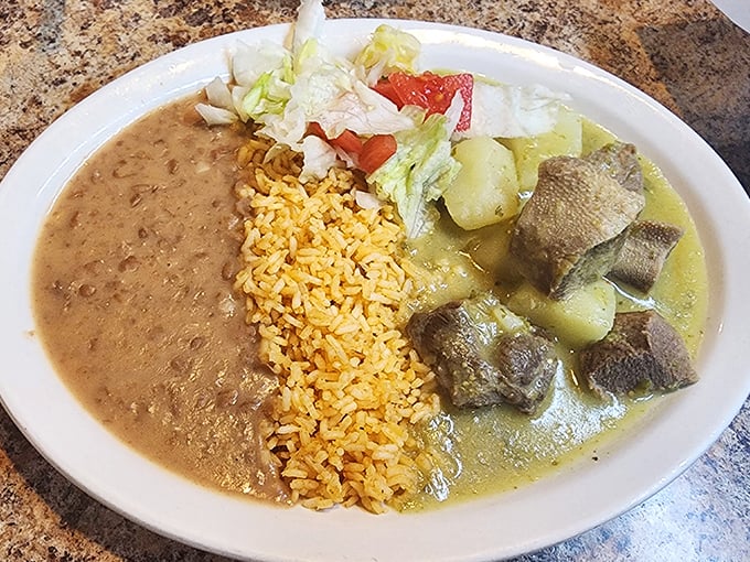 Lengua (beef tongue) in green sauce – a dish that converts the skeptical into believers with its melt-in-your-mouth texture and bright, herbaceous bath.