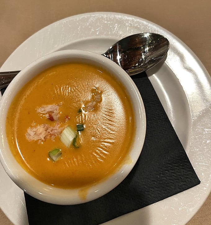 This copper-hued lobster bisque doesn't just warm your stomach—it hugs your soul with each velvety spoonful of oceanic bliss.