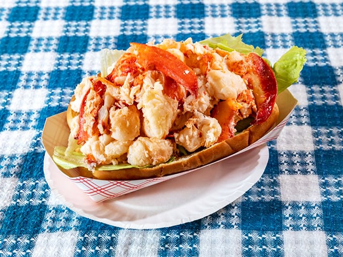 The lobster roll – summer in New England distilled into edible form. That buttery bun cradles seafood royalty with the respect it deserves.