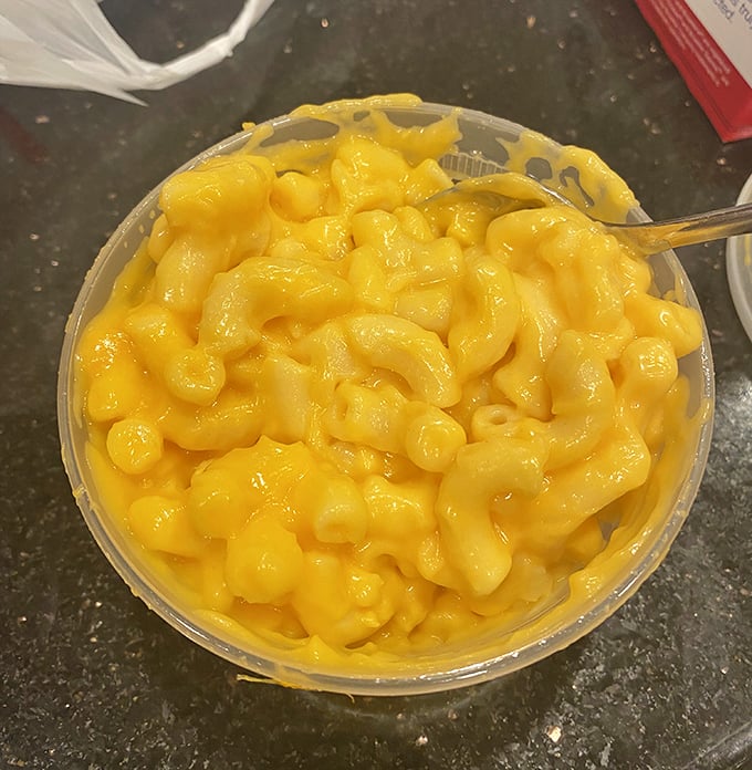 This mac and cheese isn't trying to be fancy with truffle oil or lobster – it's just being its best, gloriously cheesy self, and that's more than enough.