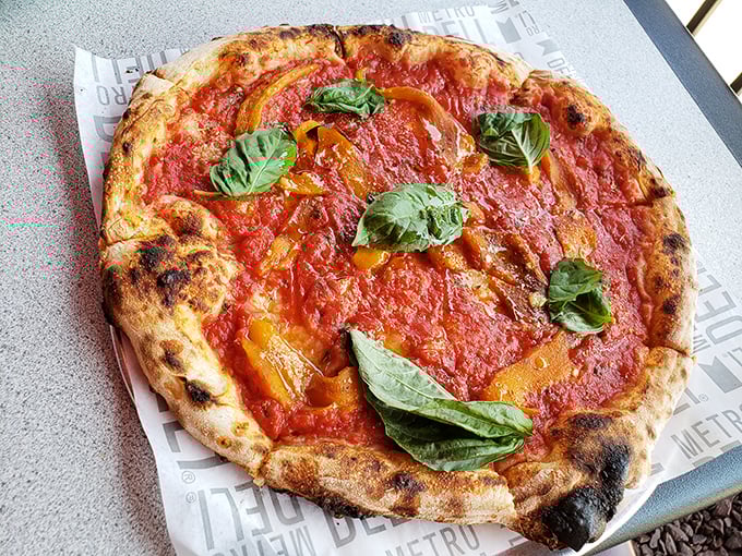The Margherita pizza—where simplicity meets perfection. Those charred edges are the pizza equivalent of a perfect sunset.