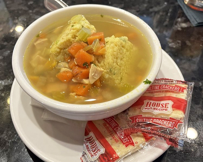 Matzo ball soup that grandmother would approve of—golden broth, tender vegetables, and a matzo ball that's achieved that perfect cloud-like consistency.