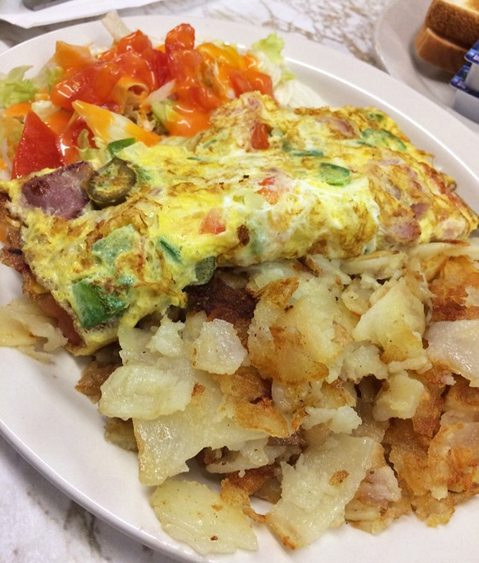This Mexican omelet doesn't just feed your hunger—it tells a story of Detroit's cultural tapestry, served alongside crispy potatoes that could make a hash brown weep with envy.