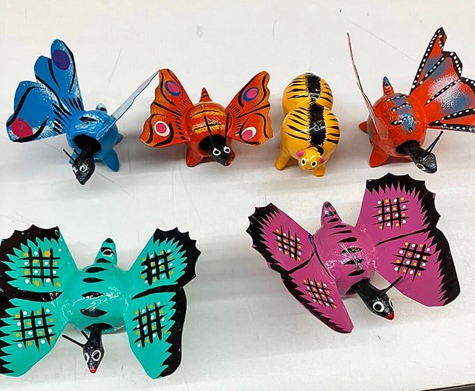 These vibrant hand-painted butterflies and critters bring folk art charm to any shelf, like tiny ambassadors from a more colorful dimension.