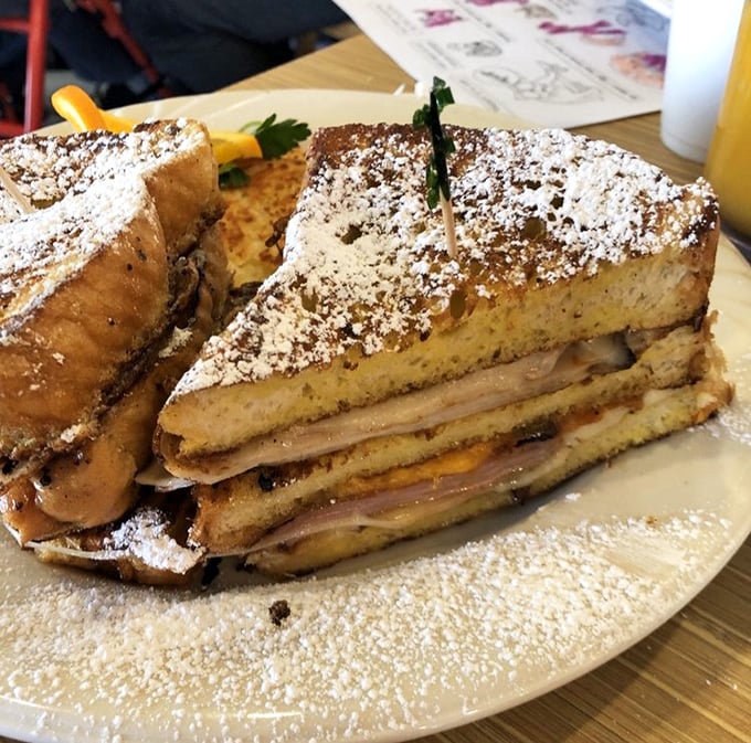 This Monte Cristo sandwich isn't just breakfast—it's dessert masquerading as a morning meal, complete with powdered sugar disguise.