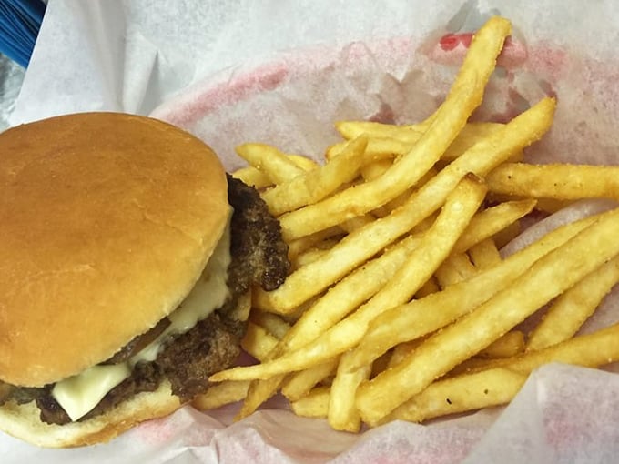 This isn't just a burger and fries—it's edible nostalgia, served on a paper-lined basket that crinkles with each delicious bite.