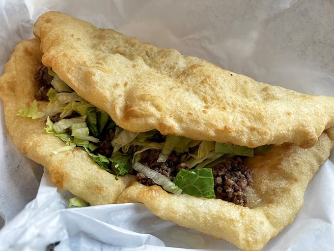 The Native taco—a perfect marriage of golden fry bread and savory fillings that puts every food truck "fusion" attempt to shame.