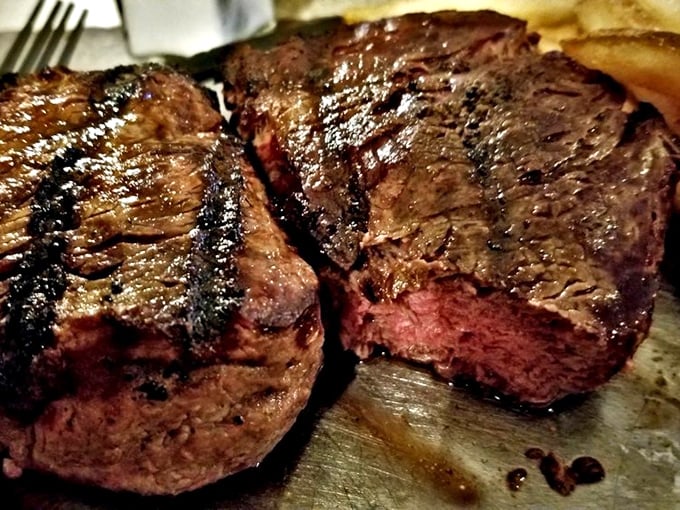 Grill marks that tell a story. These expertly seared New York strips showcase the kitchen's commitment to proper technique and temperature control.