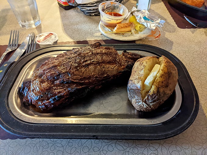 A steak so perfectly grilled it deserves its own Instagram account. That baked potato isn't just a side—it's a co-star.