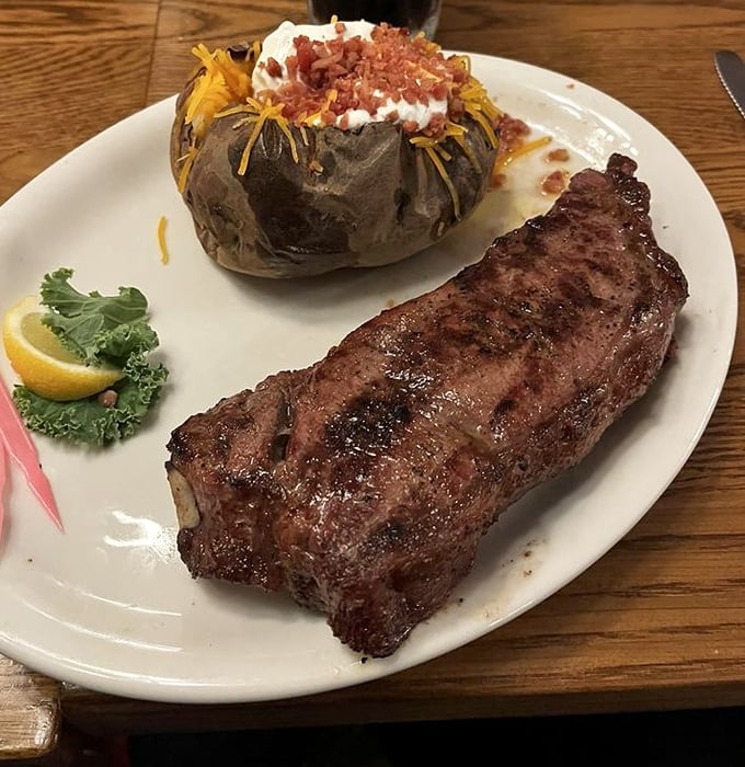 This New York Strip, paired with a loaded baked potato, isn't just dinner—it's a celebration of what happens when fire meets beef.