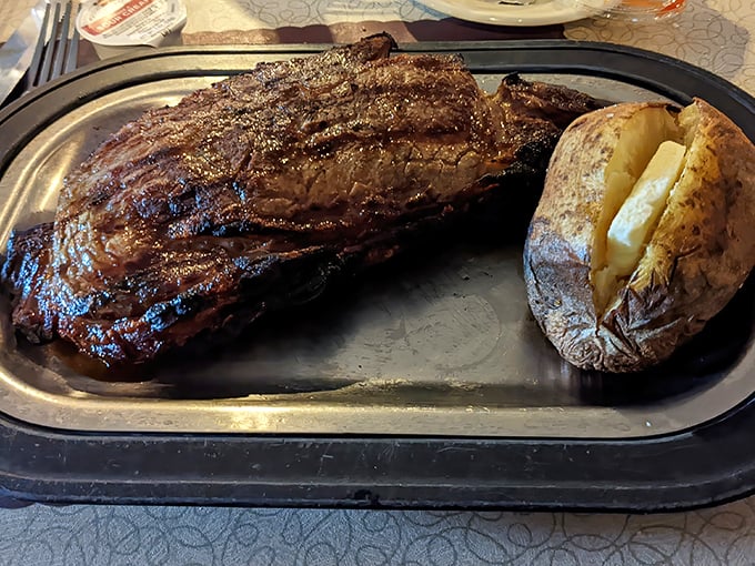 The New York Strip might be named for another state, but Schwarz's has taught it proper Wisconsin manners. That baked potato isn't just a side—it's a necessity.