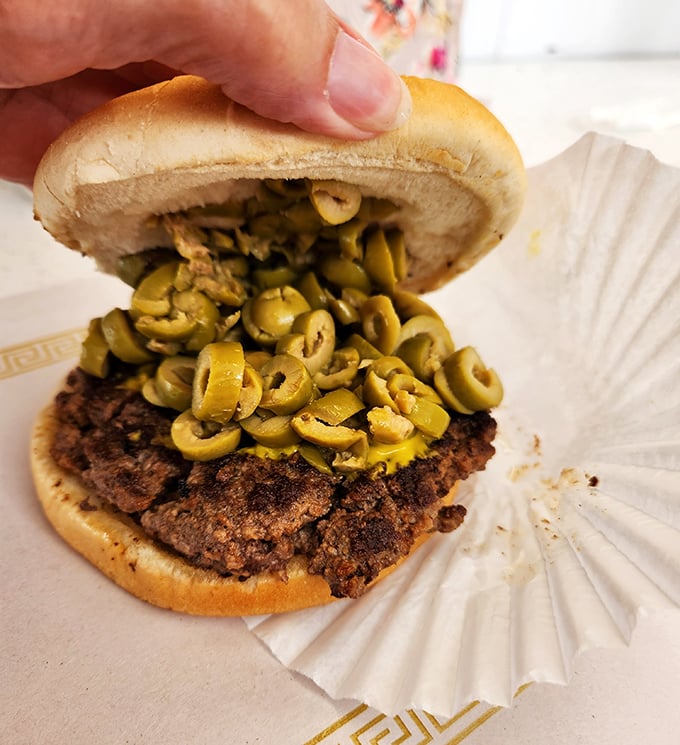 Michigan's olive burger tradition gets the Clyde's treatment - generous, messy, and absolutely divine.