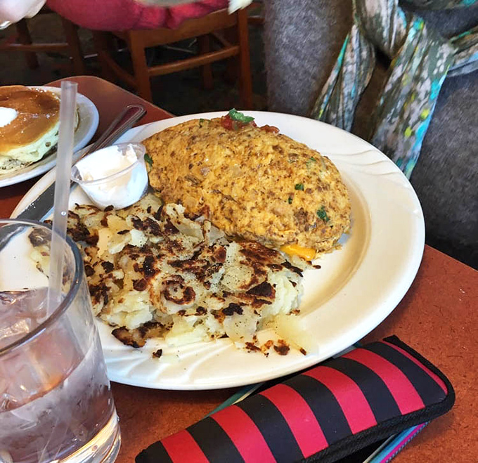 This omelet could win awards for fluffiness, while those hash browns have achieved the holy grail of breakfast potatoes – crispy exterior, tender heart.