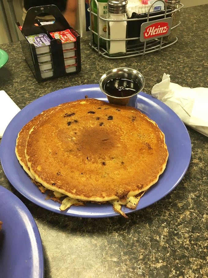 This pancake isn't just breakfast – it's a golden-brown canvas of possibility, ready for its maple syrup waterfall moment.