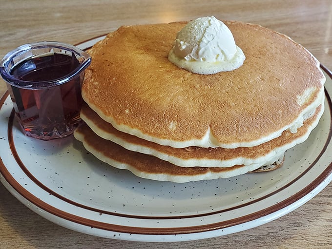 Pancakes so perfectly golden they deserve their own Nevada state medal. That pat of butter melting on top is performing a delicious disappearing act.