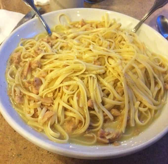 Linguini that would make an Italian grandmother nod in approval—simple, honest pasta swimming in a light sauce with chunks of chicken throughout.
