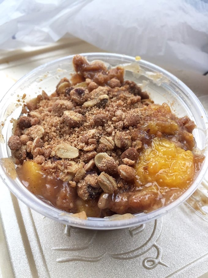 Not just dessert, but Southern salvation in a cup – peach cobbler with a crumbly topping that would make grandmothers nod in approval.