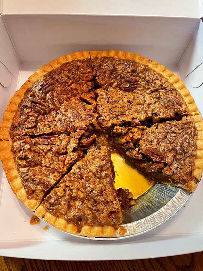 This pecan pie isn't just dessert, it's architecture – a perfect foundation of flaky crust supporting a caramelized pecan skyline.