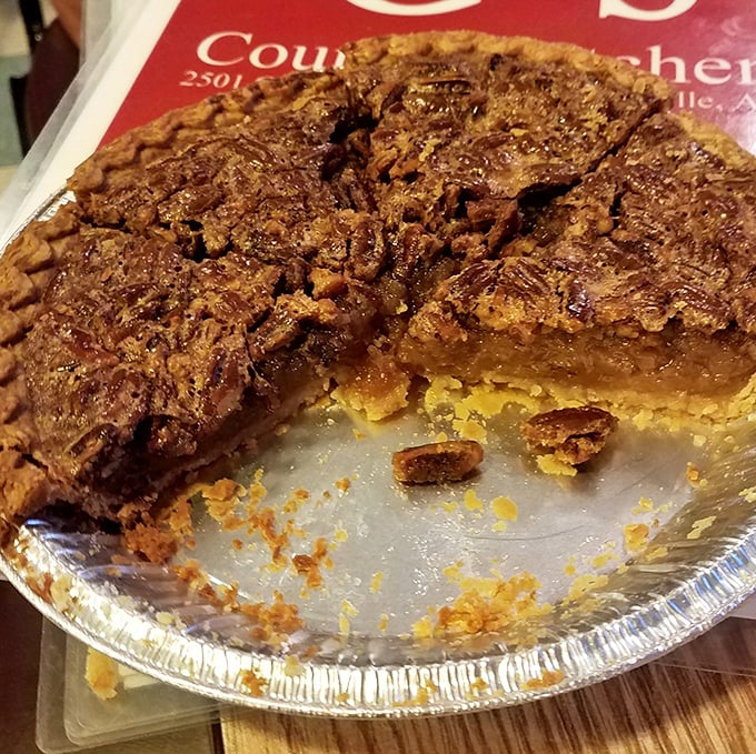 This pecan pie isn't messing around – with its perfect gooey-to-crunchy ratio and deep amber filling, it's the kind of dessert that makes you consider skipping the main course entirely.
